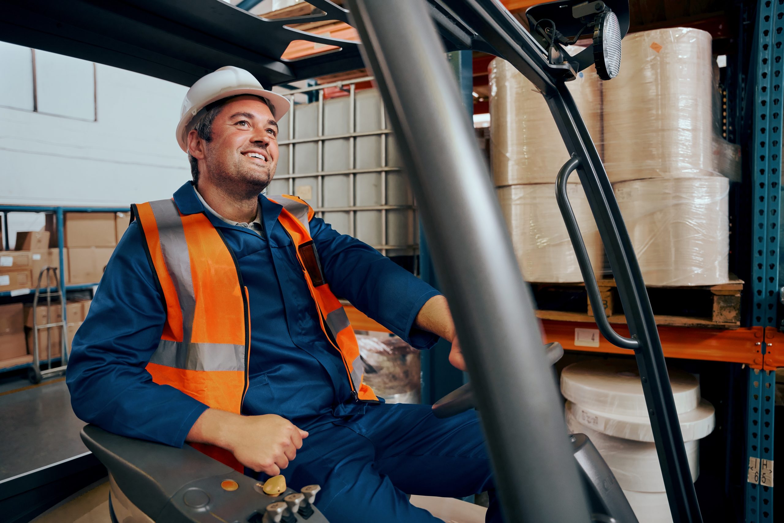 Happy Engineer Operating Forklift Truck In Warehouse - Cross-Docking ...
